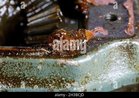 Worn grease can be seen inside the cog wheels unit. This is a partial ...