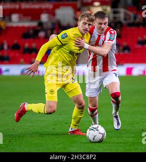 Rico Henry of Brentford under pressure from João Palhinha of Tottenham ...