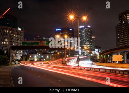 Traffic light trails on Aspen Way, Canary Wharf London England UK Stock ...