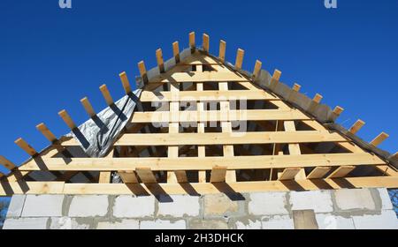 Roofing construction. Installing wooden rafters, frame timber with ...