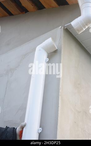 Home rain water drainage downspout gutters on the exterior of a single ...