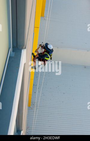 Maintenance Work by an Abseiling Technician Stock Photo - Alamy