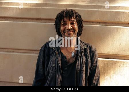 One person standing alone against beautiful color circle LED light ...