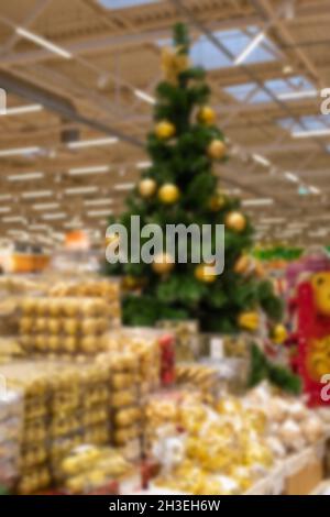 Blurred Christmas supermarket. Sale of festive Christmas accessories in ...