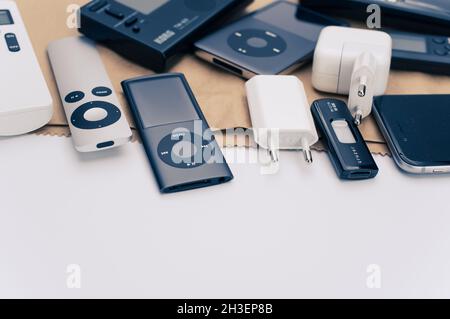 various consumer electronics and gadgets devices randomly placed on a ...