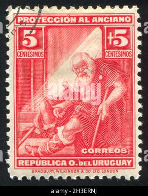 URUGUAY - CIRCA 1930: stamp printed by Uruguay, shows Indigent Old Man ...