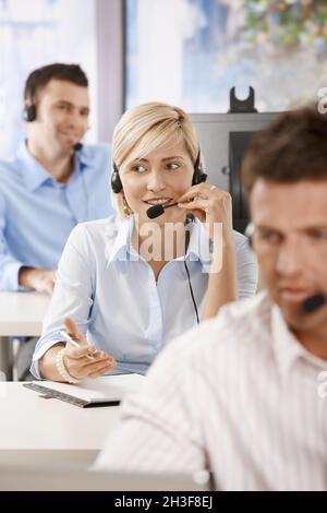 Operator talking on headset Stock Photo - Alamy