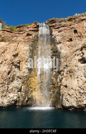 A small waterfall drops into the Mediterranean Sea on the Antalya ...
