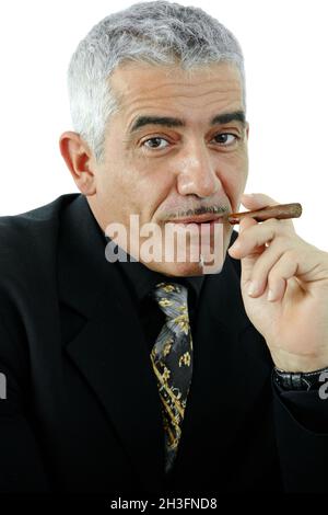 Studio shot of Italian businessman wearing black suit against brown ...