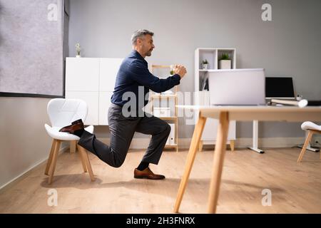 Standing Office Yoga Workout And Workout Near Business Computer Stock ...