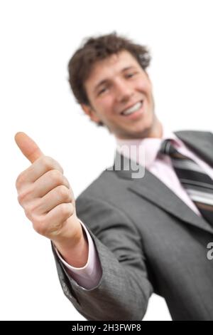 Cheerful businessman showing yeah gesture while talking on smartphone ...