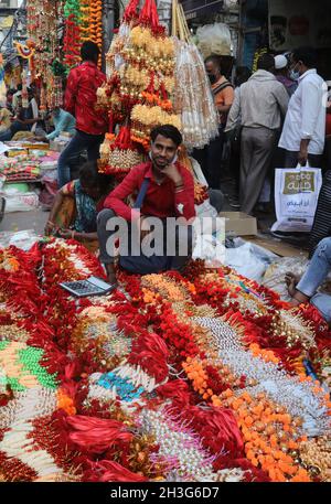 A street vendor waits for customer at the old main bazaar of Tehran ...