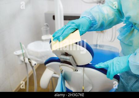 A nurse disinfects work surfaces in the dentist's office Stock Photo ...