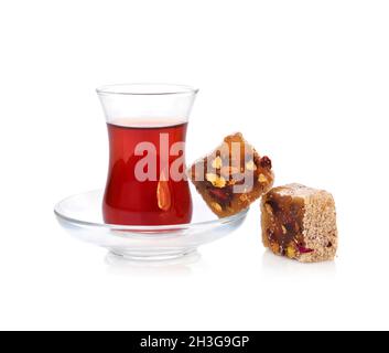Traditional turkish delight (rahat lokum) in white ceramic plate with ...