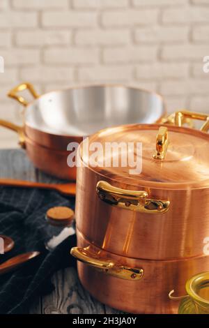 Close up of a set of copper cookware Stock Photo - Alamy