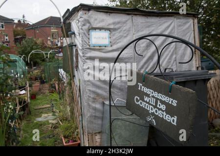 Signs on gate of allotments in Orsett, Essex, UK, asking people to turn ...