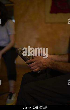 Man playing a Mbira, a musical instrument from Zimbabwe in a park in ...