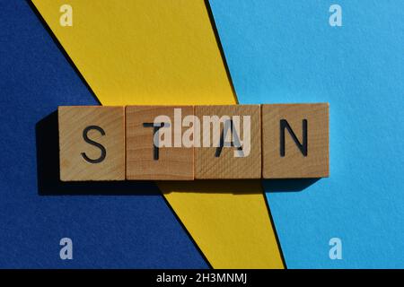 Stan, word in wooden alphabet letters isolated on purple background ...