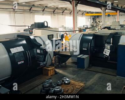 Oil parts machine. Details of flasks and other products Stock Photo - Alamy