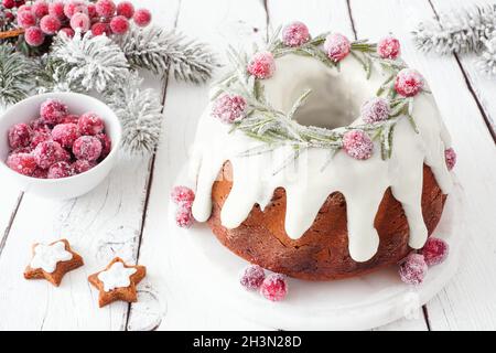 Snowy winter scene of Christmas wreath on rustic wooden door in adobe ...
