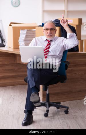 Old businessman employee ordering box via Internet Stock Photo - Alamy