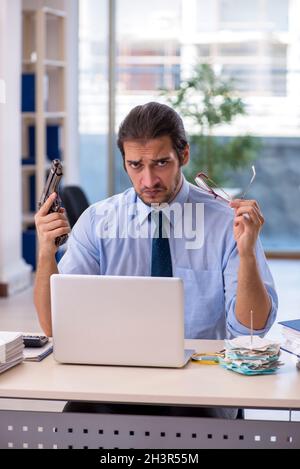 Angry bookkeeper in bankruptcy concept Stock Photo - Alamy