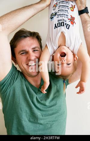 Raised with love. an adorable little girl showing the heart symbol while standing outside Stock ...