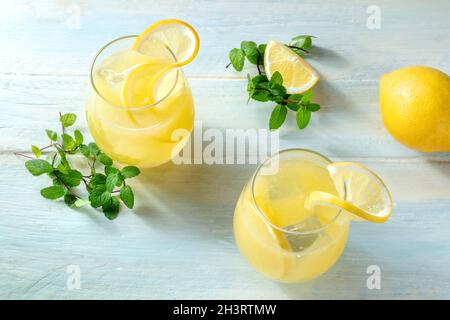 Homemade Lemon Juice on an wooden table (selective focus) as detailed ...