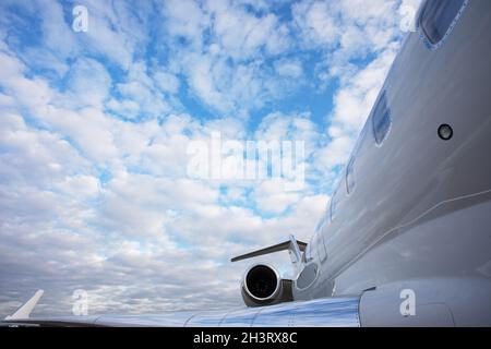 Private jet with part of wing Stock Photo - Alamy