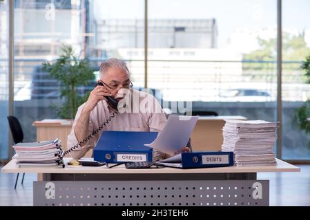 Old male bookkeeper in budget planning concept Stock Photo - Alamy