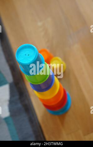 Vertical shot of the toy plastic pyramid cups on the floor Stock Photo ...