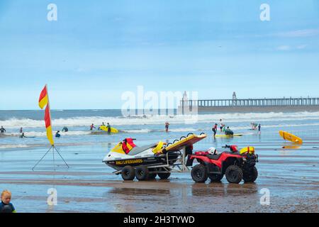 RNLI lifeguard ATV with rescue power boat on trailer on beach at Whitby ...