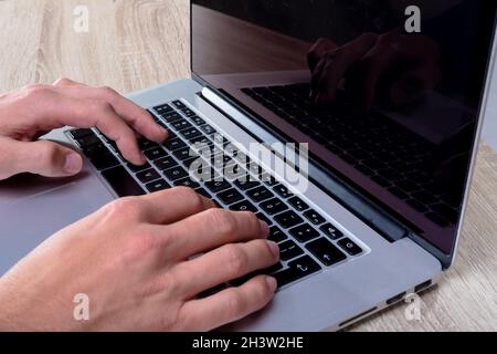 Midsection of caucasian businessman typing on keyboard, isolated on ...