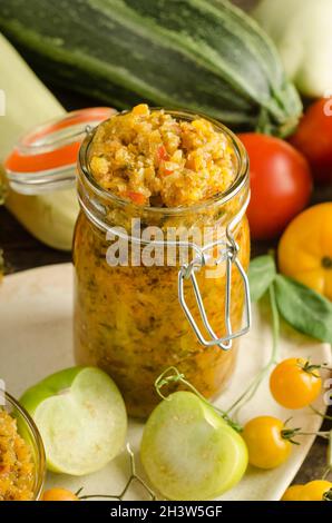 Zucchini caviar in a glass jar, homemade autumn preparations, with ...