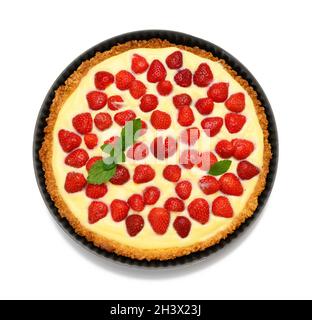 baked round tart with strawberries and tender milk cream on a white ...