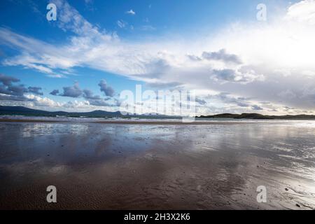 Sunset reflections at Traeth Llanddwyn, Anglesey Wales UK Stock Photo ...