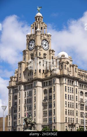 Facade of the Royal Liver Building in Liverpool against a blue cloudy ...