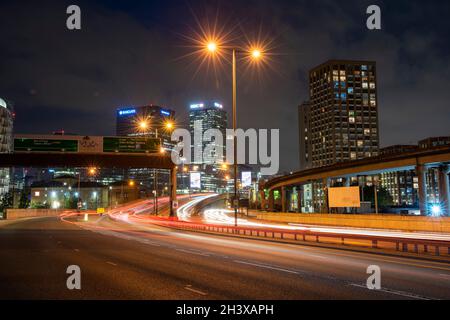 Traffic light trails on Aspen Way, Canary Wharf London England UK Stock ...