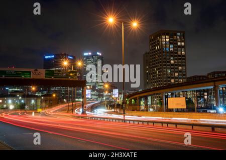 Traffic light trails on Aspen Way, Canary Wharf London England UK Stock ...