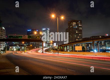 Traffic light trails on Aspen Way, Canary Wharf London England UK Stock ...