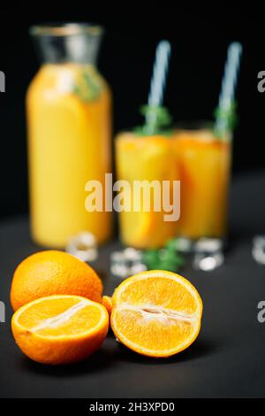 A fresh delicious cocktail with fruits and ice cubes on a table Stock ...