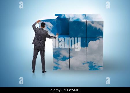 Businessman building cloud cube with the shapes Stock Photo - Alamy