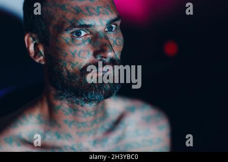 Young adult man with word Psychology on his face in the dark Stock ...