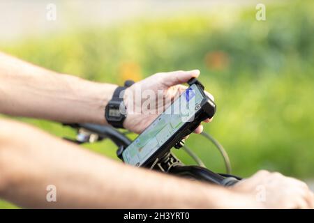 Bicycle GPS Navigator App With Map On Mobile Phone Stock Photo - Alamy