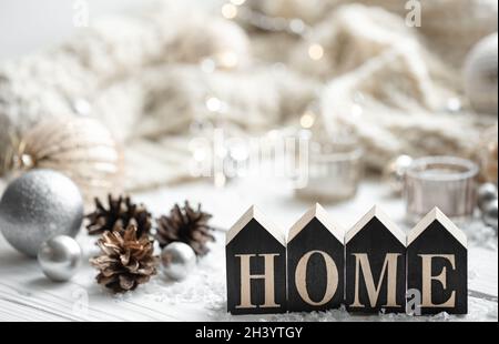 Cozy winter composition with decorative word home and paper christmas ...
