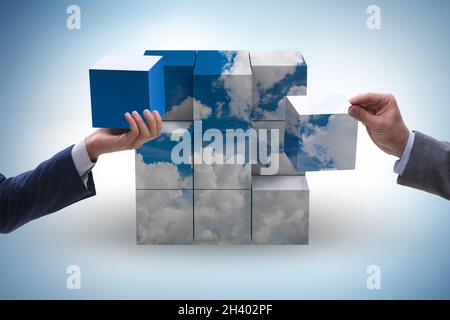 Businessman building cloud cube with the shapes Stock Photo - Alamy