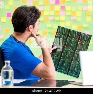 Young doctor with many reminders and urgent work Stock Photo - Alamy