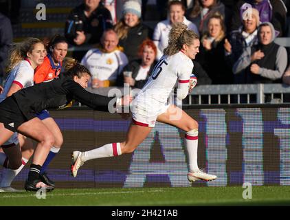 England's Ellie Kildunne runs in to score her sides first try during ...