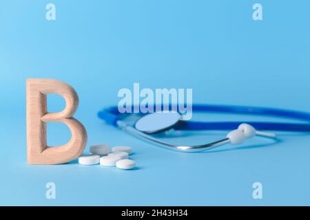 Letter B with stethoscope and pills on color background Stock Photo - Alamy