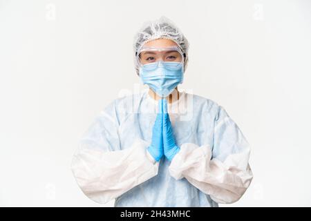 Please vaccinate. Smiling asian female doctor or nurse in personal ...